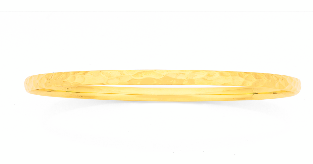 9ct Gold 6x65mm Hollow Hammered Bangle | Prouds